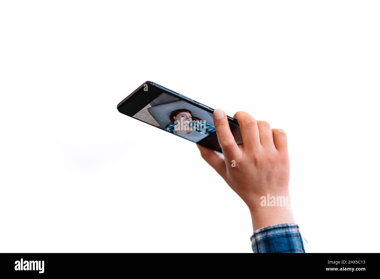 Hand of a young girl taking a selfie Stock Photo - Alamy