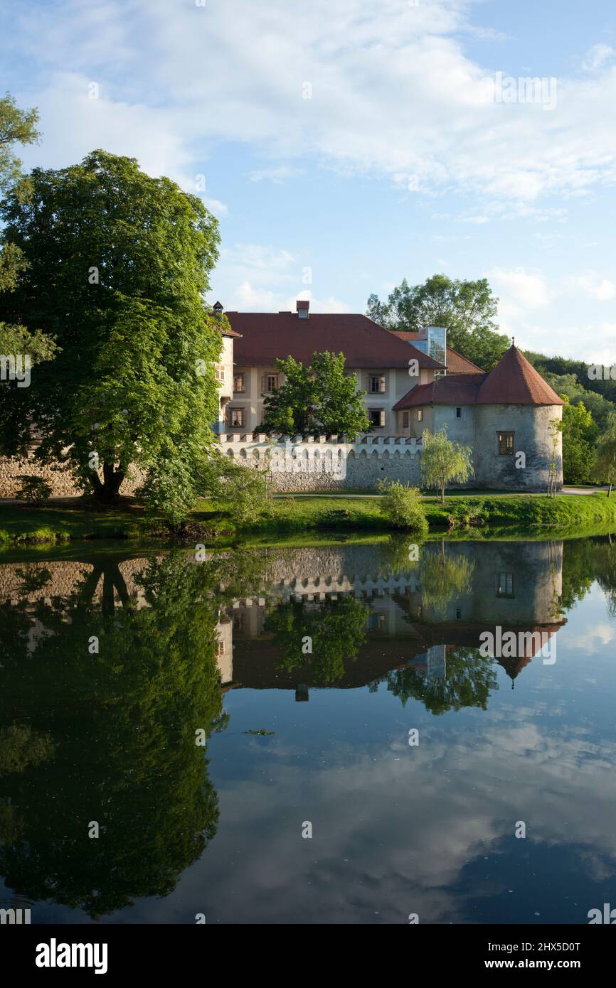 Slovenia, Lower Carniola, Otocec, castle across Krka river Stock Photo ...