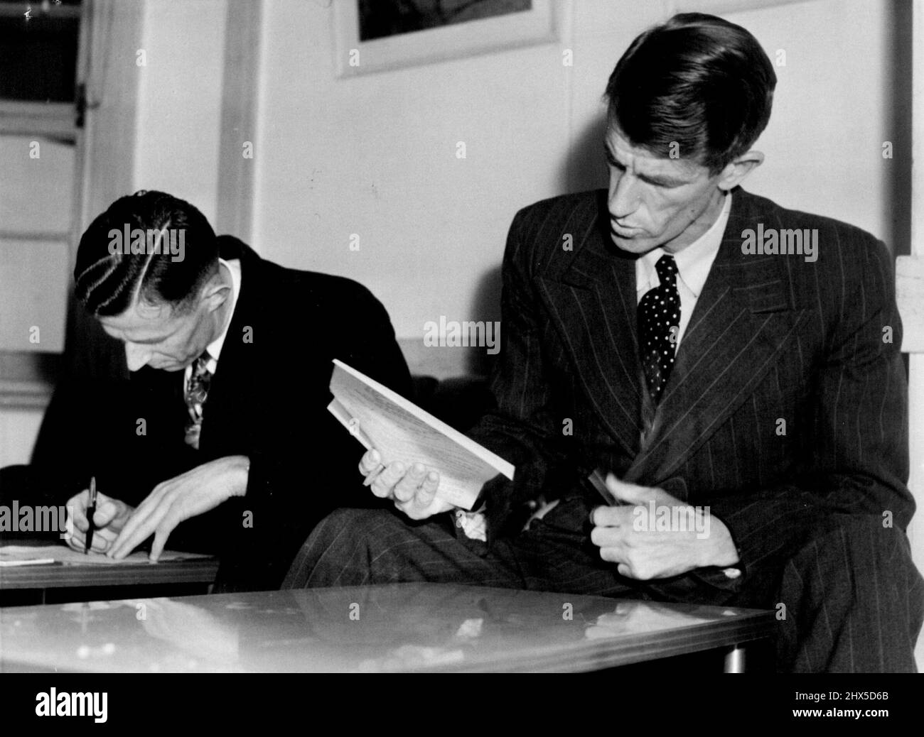 Rex Hillary with his brother Sir Edmund Filling in the custom forms at ...