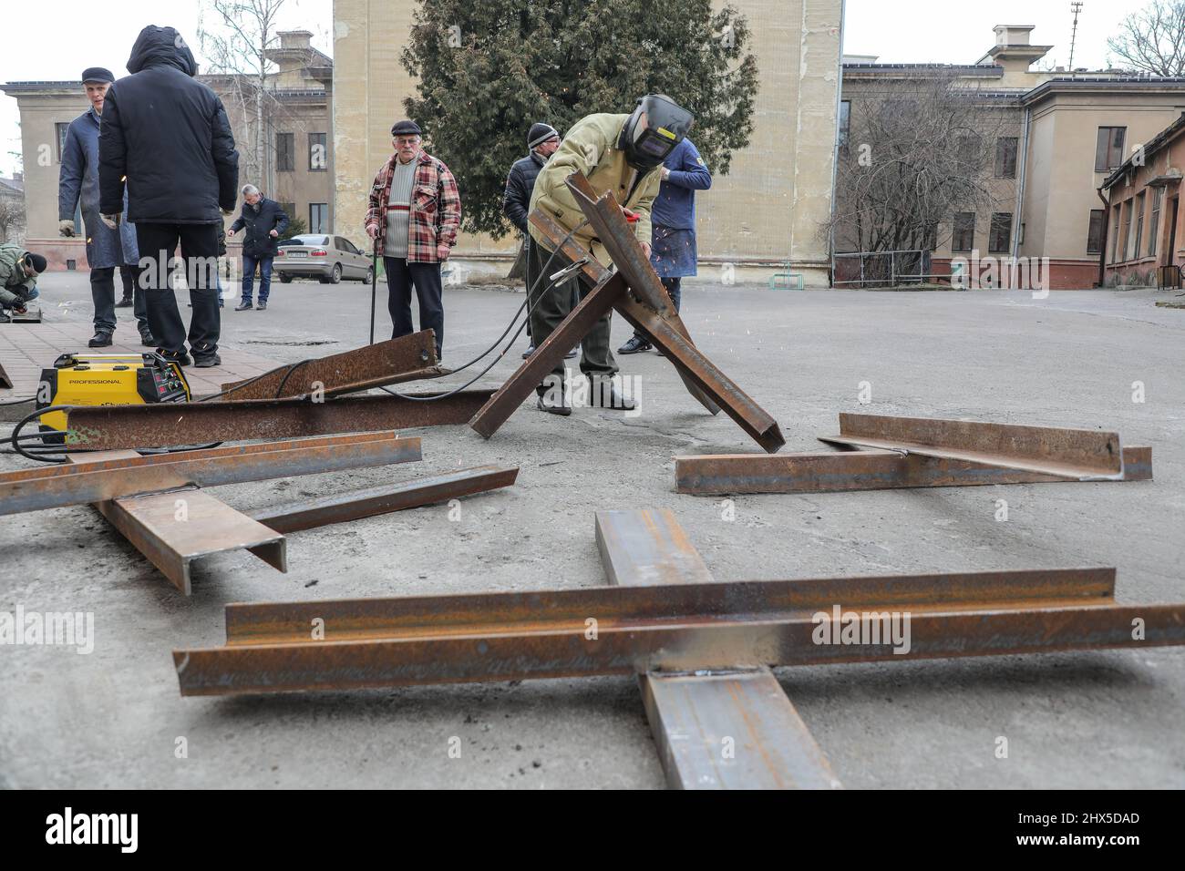 People make anti-tank Czech hedgehogs obstacles in Lviv amid Russian ...