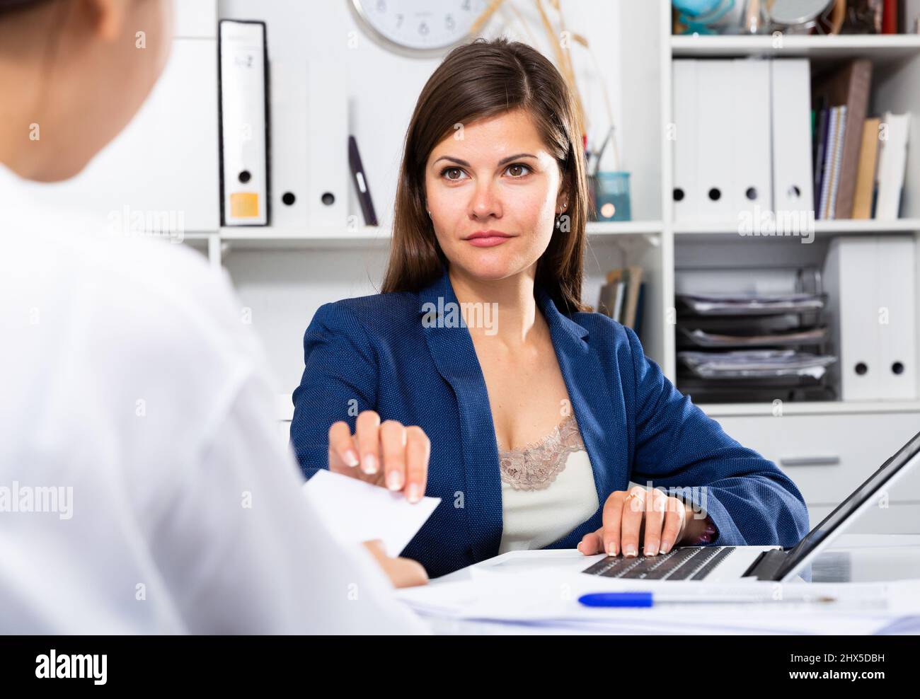 Successful businesswoman communicates with the client in the office ...