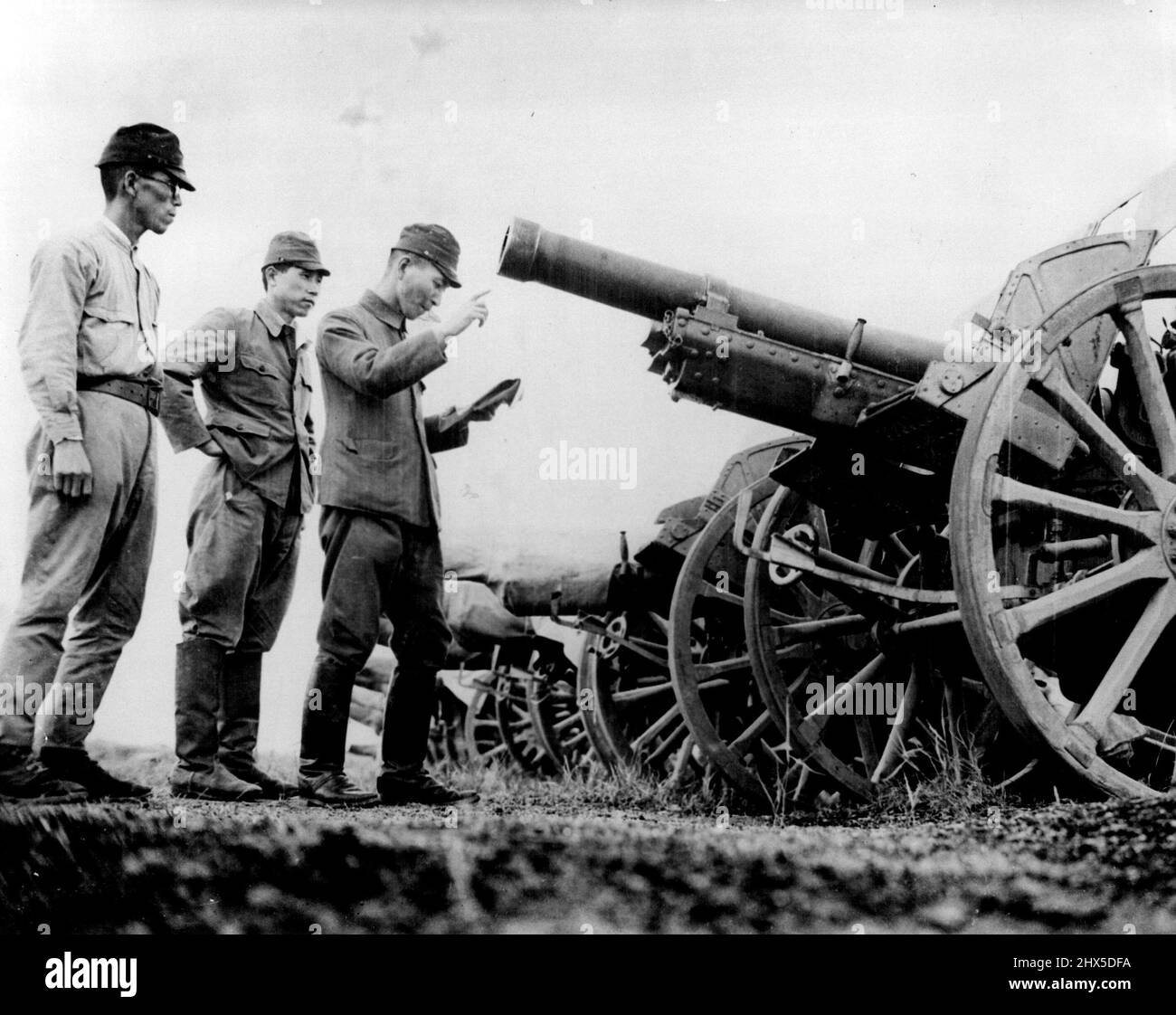 Japanese "check" their Weapons -- A Japanese officer and two enlisted ...