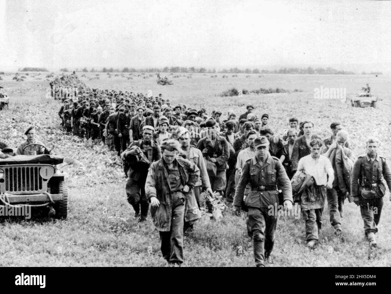 Military uniform line marching prisoners ww2 Black and White Stock ...