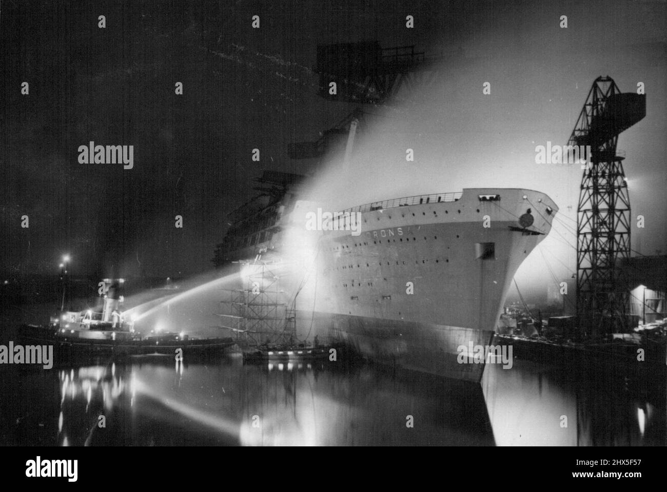 Blazing 'Oronsay' Lists in Rock: During the night, fireman pump water ...