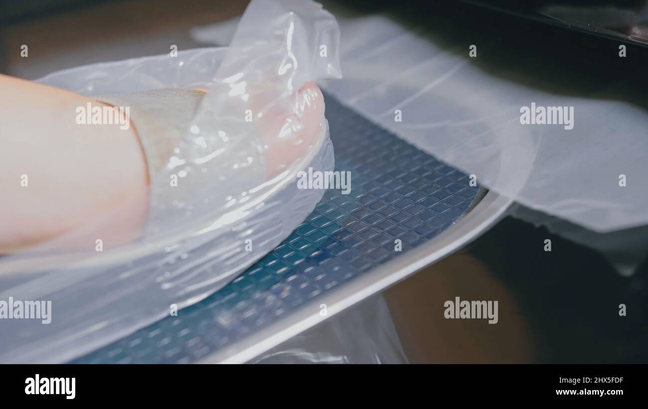 Automatic Thermal Shrinkable Shoe Cover Laminating Machine. Close up ...