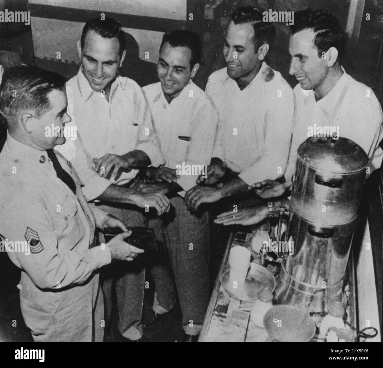 Quads Taken Exam -- Sgt.Truman L. Douglass matches coping with the 20 ...