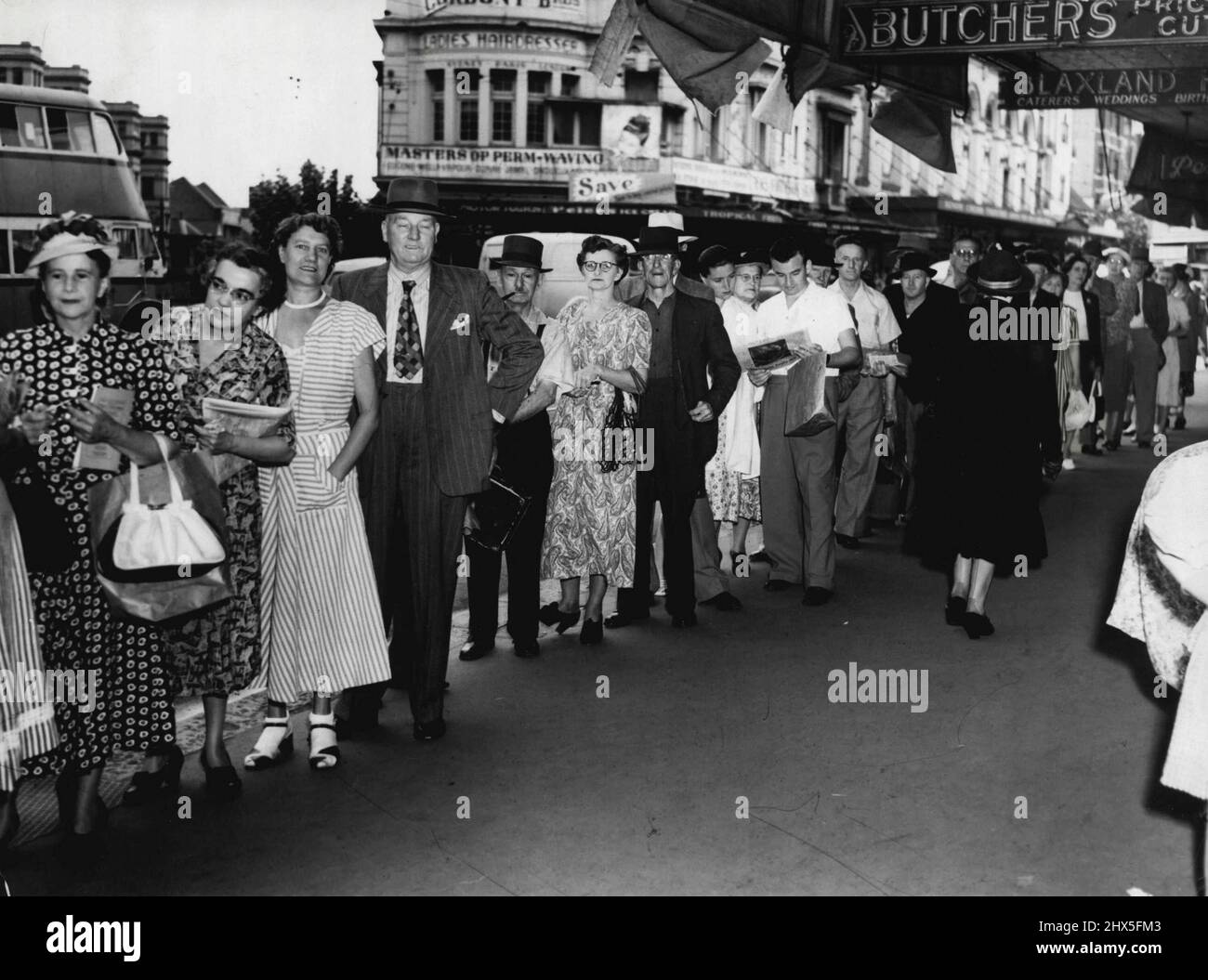Bread Queue outside a King's Cross baker's shop yesterday. Many of the customers come from ...
