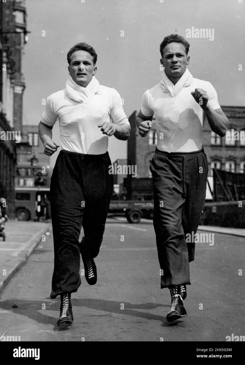 They'll Knock 'Em From The Old Kent Road -- Henry Cooper (on left) and ...