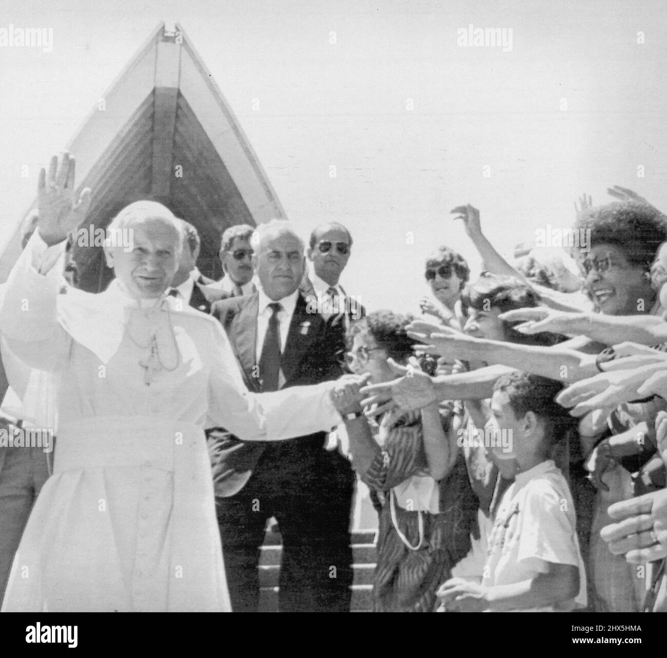 Pope John Paul II waves to waiting crowds after leaving Sydney opera ...