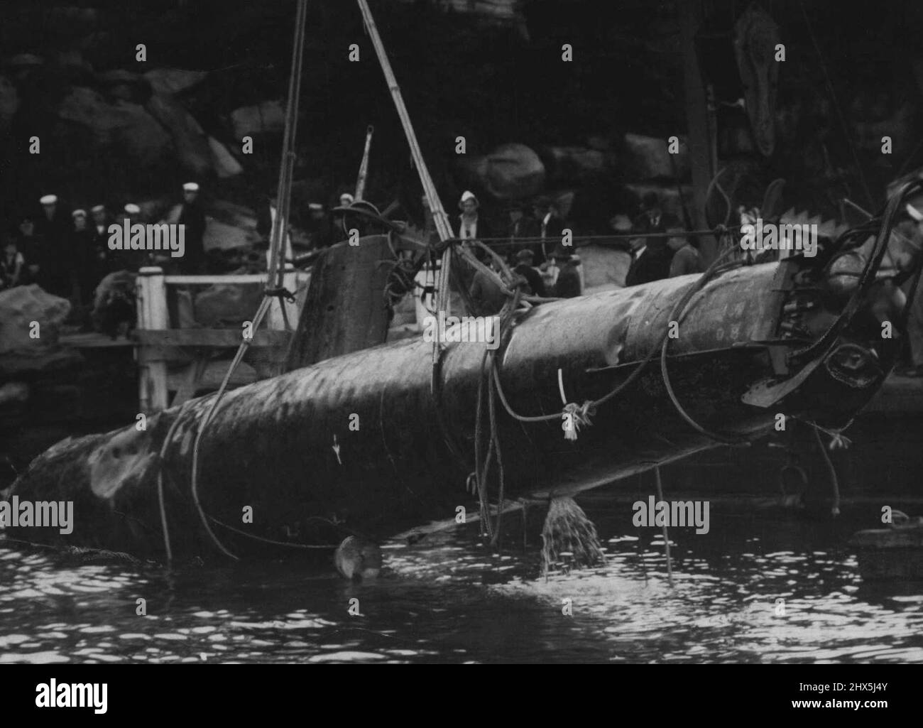 At last the difficult job of raising the sunken submarine comes to an ...
