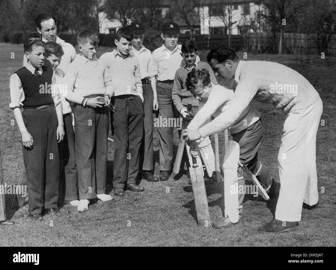 Coaching The Young Idea -- Frank Rist coaching a youthful batsman, 11 ...