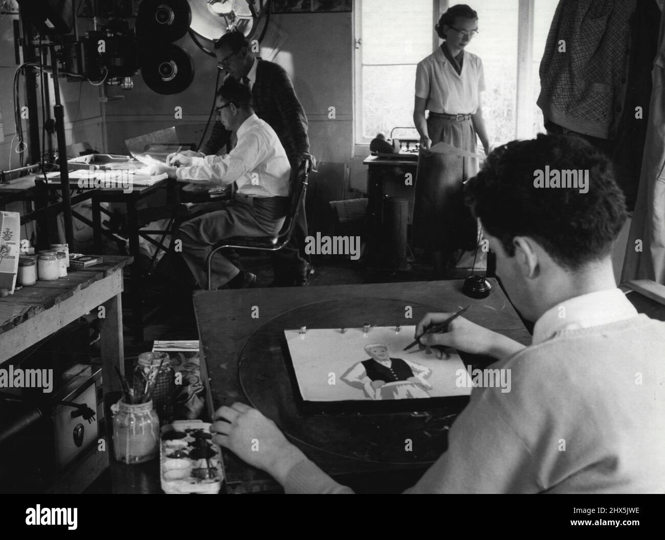 Raymond Leach in foreground tracing shoulder of original animation on ...