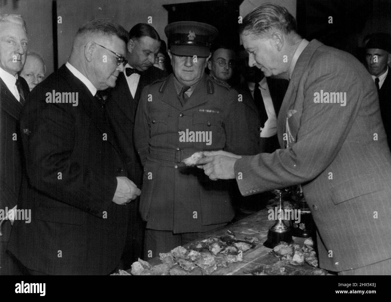 T. C. Roughley (right) explains to Mr ***** & Col McIntosh the final ...