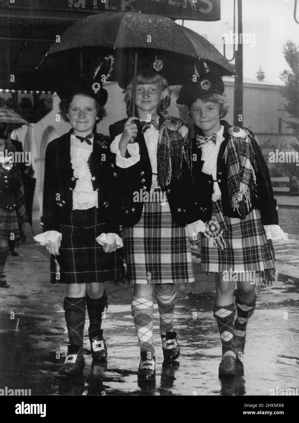 These three little Scottish Lassies needed their Umbrella when they ...