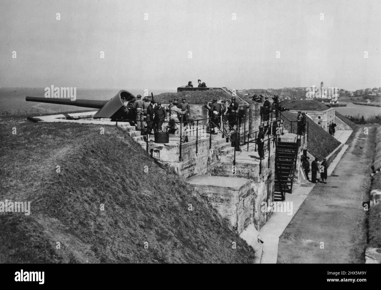 Members of the 241st Coast Artillery man a 6-inch Rapid-Firing rifle at ...