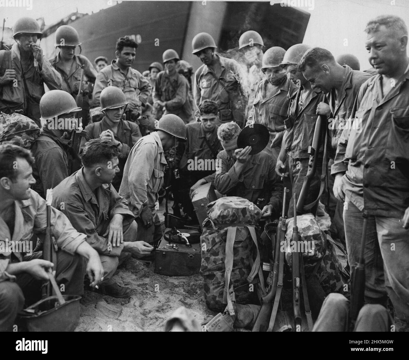 Listening to the latest songs on a Special Services office' photograph ...