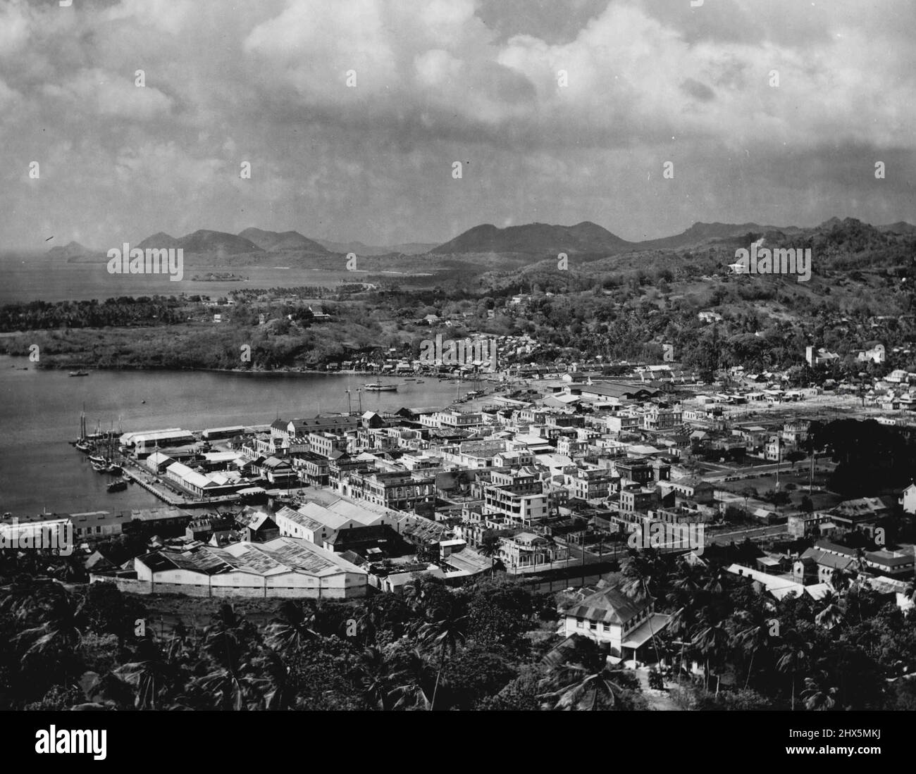 Looking down on the stark and ruined town of Castries where for a year ...