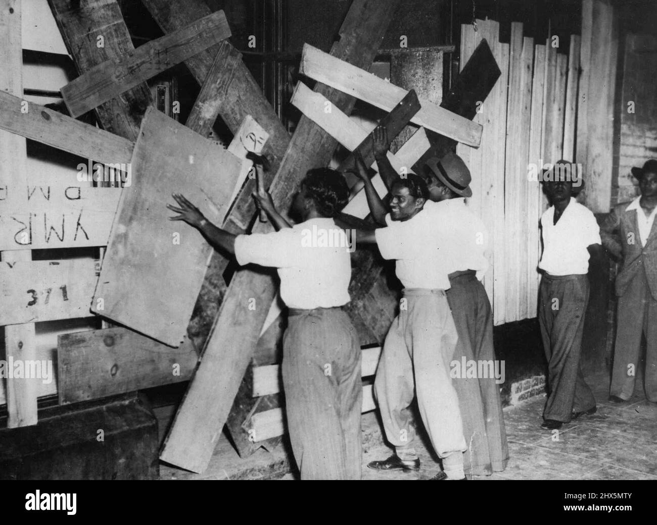 Indians board-up shops after racial riots in Africa. Indians nailing up ...