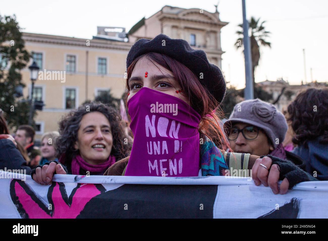 Rome, Italy. 08th Mar, 2022. A protester seen with a purple-pink scurf ...