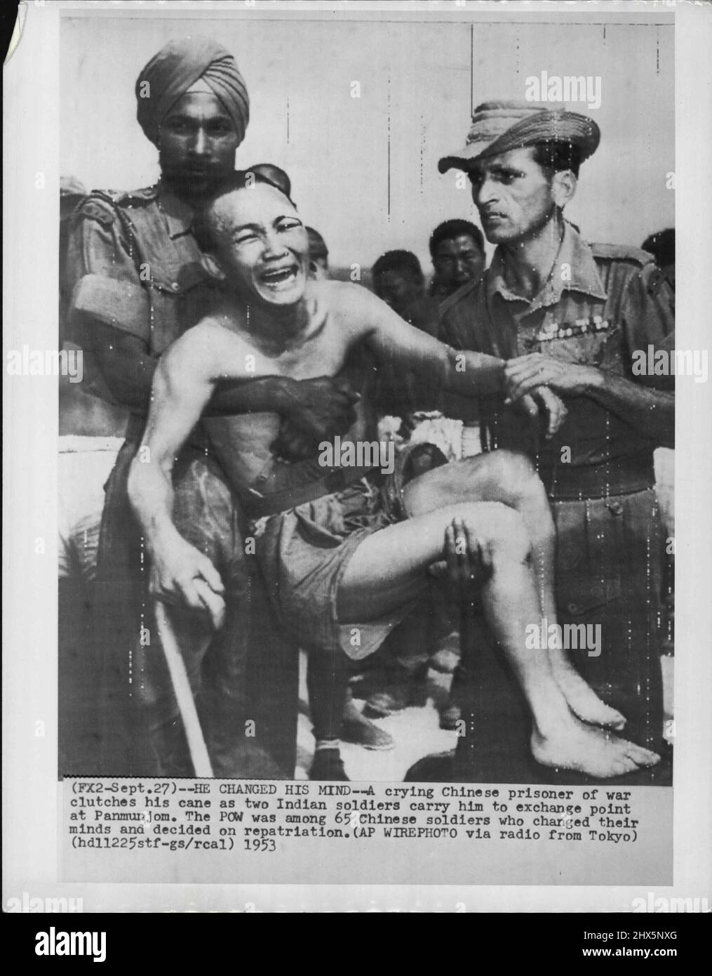 He Changed His Mind -- A crying Chinese prisoner of war clutches his ...
