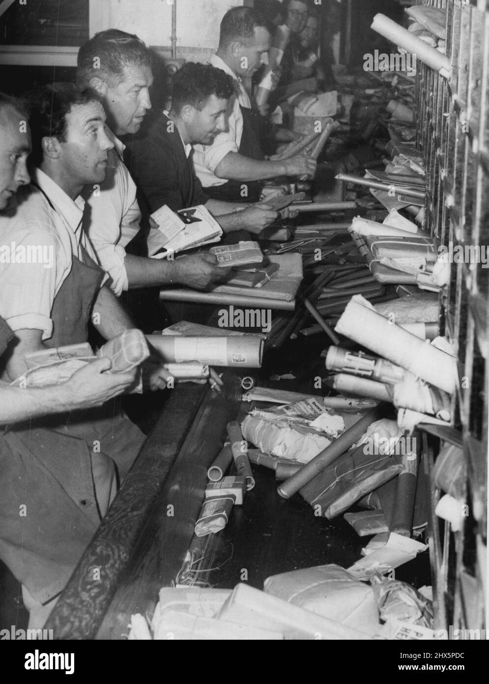 Xmas mail G.P.O. men handling flood of Xmas mail at G.P.O. December 13 ...