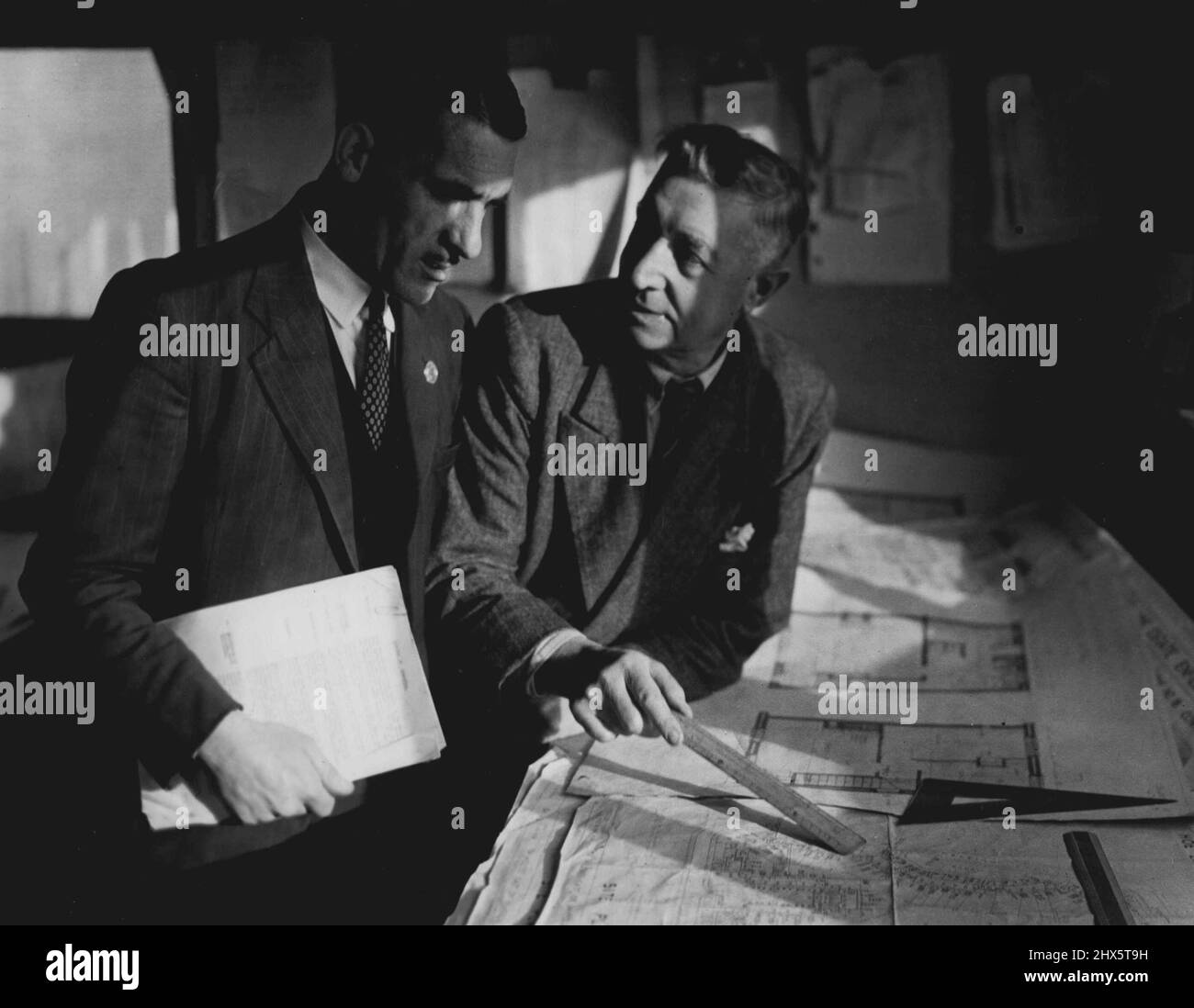 The Houses Go Up -- In the general foreman's office. Mr. E. W. Martin ...