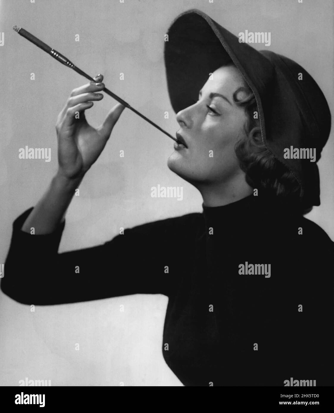 Long Smoke Maree Morgan, of Kogarah, demonstrates with aid of a giant ...