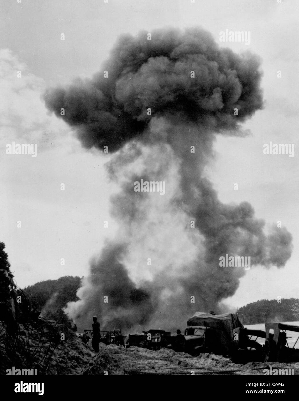 American lined up on beach at Humboldt Bay. Burning Japanese stores ...