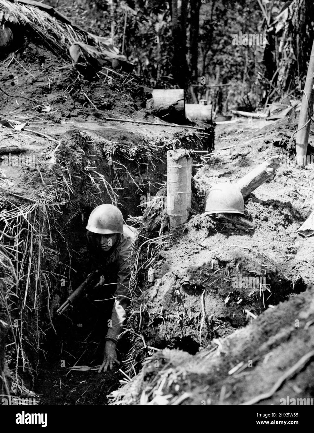 Pvt. Michael Negast of Patterson, N.J., crawls through a narrow ...