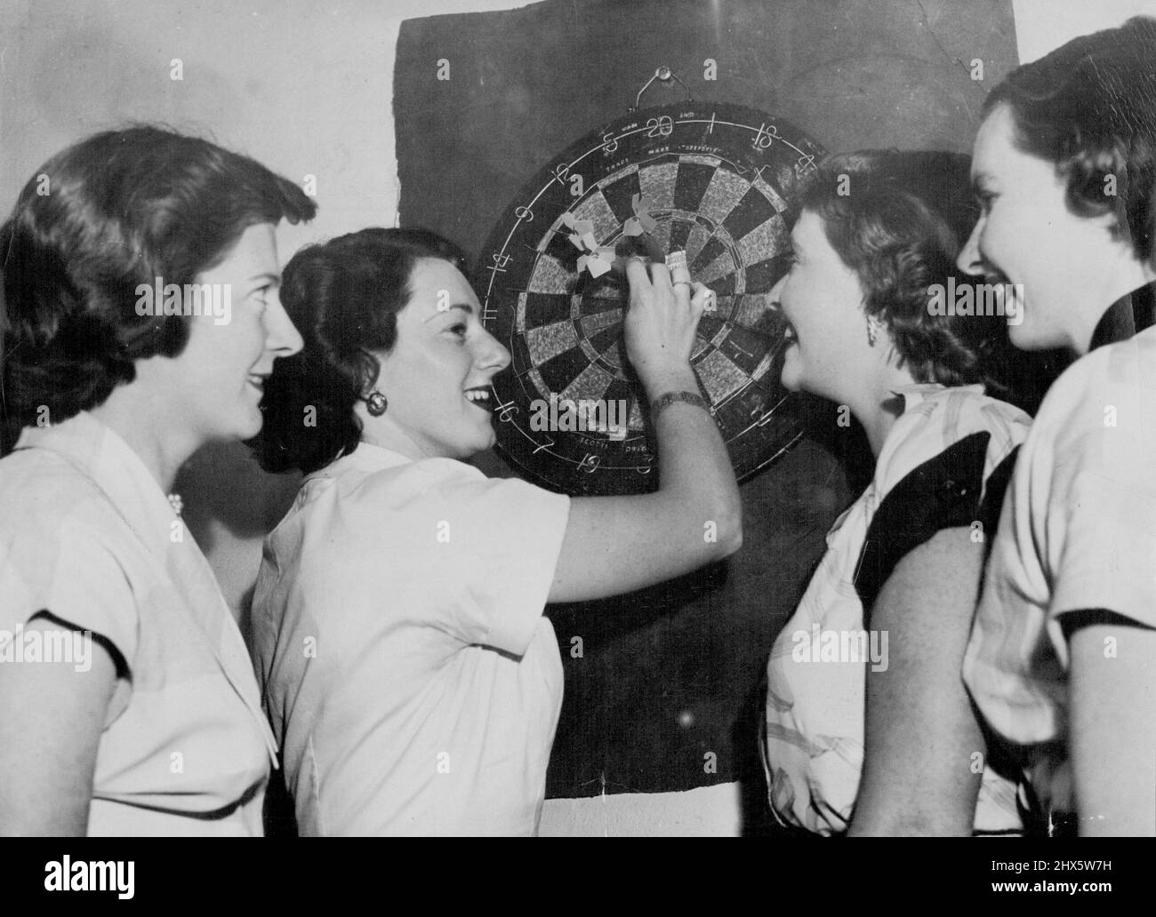 Inspecting Aim at dart-board are Patricia Lowe, of Earlwood, Joy Butler ...