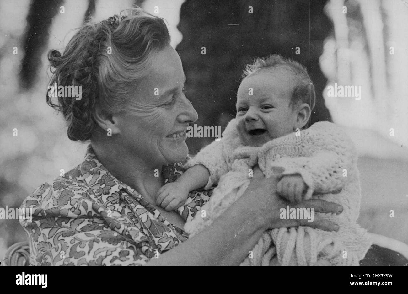 Mrs. Cook, who was a prize-winning Rower before her marriage, with her ...