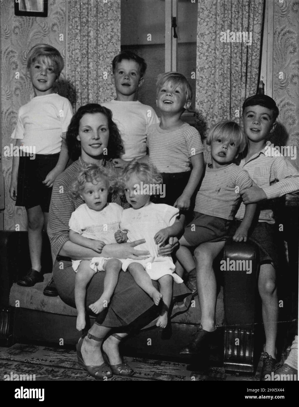 With Mrs. Eileen Moorman, 29, are one-year-old twins Kevin and Barry on ...
