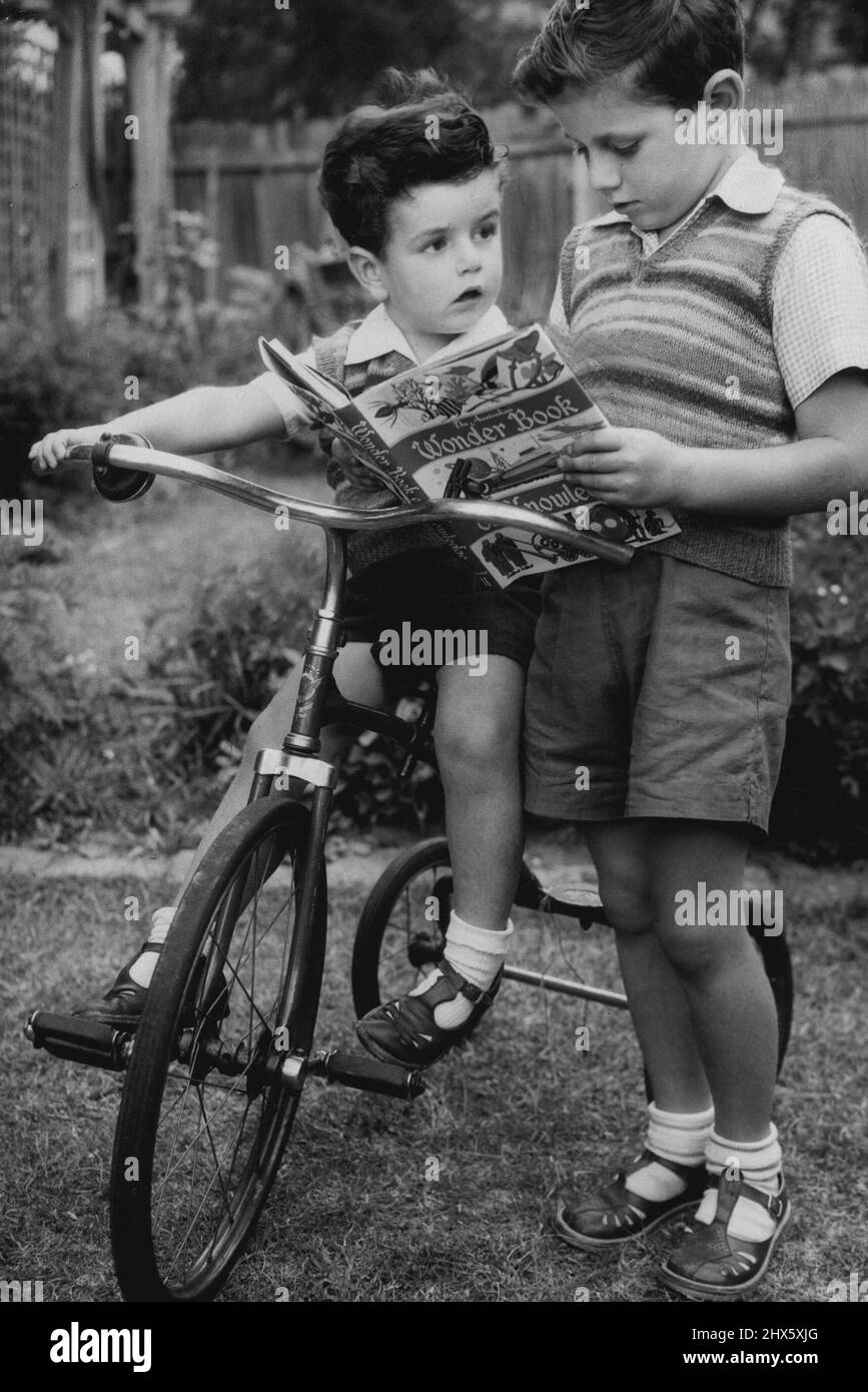 Peter Brown, 7, shows the Australian Wonder Book of Knowledge Volume 2 ...