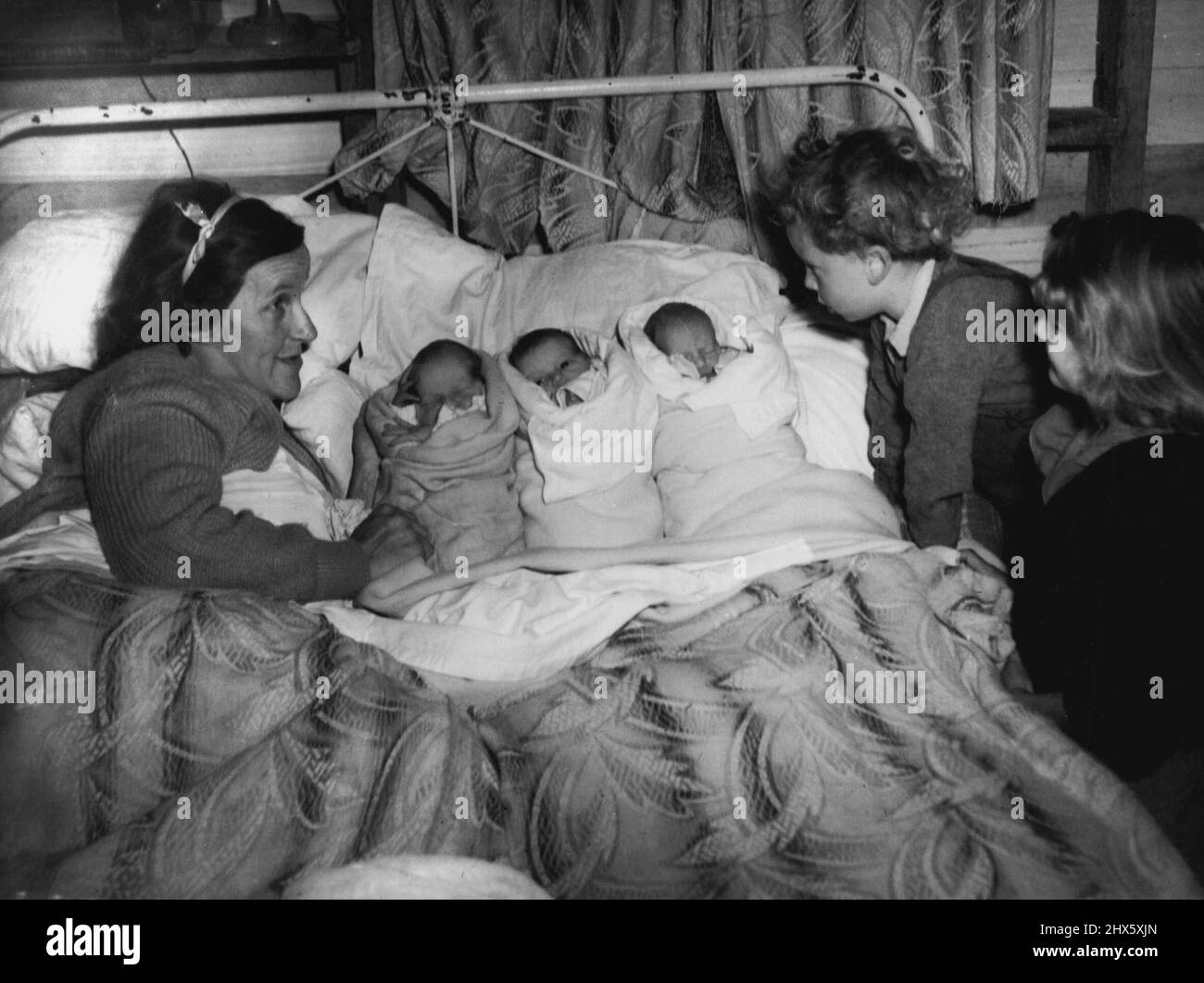Sullivan Triplets (from left) James, Marie and Ivan are introduced to ...