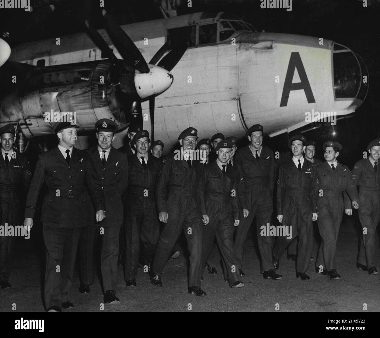 Crew and maintenance men leaving a R.A.F. Shackleton aircraft after ...