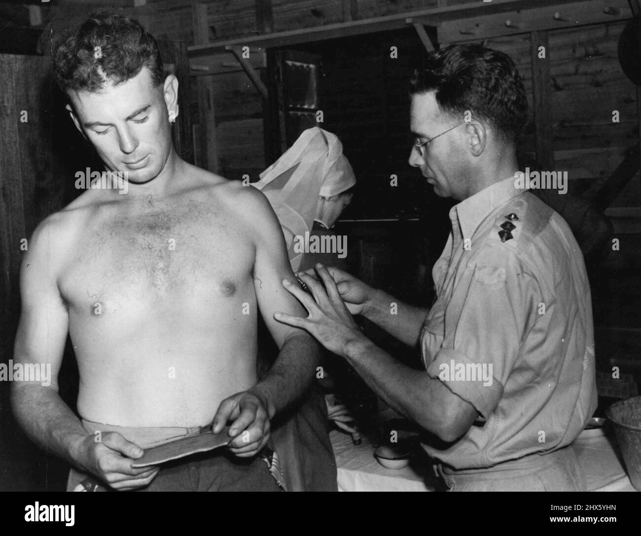 Inoculation -- Men of the A.I.F., at the rate of about 900 a day, pass ...