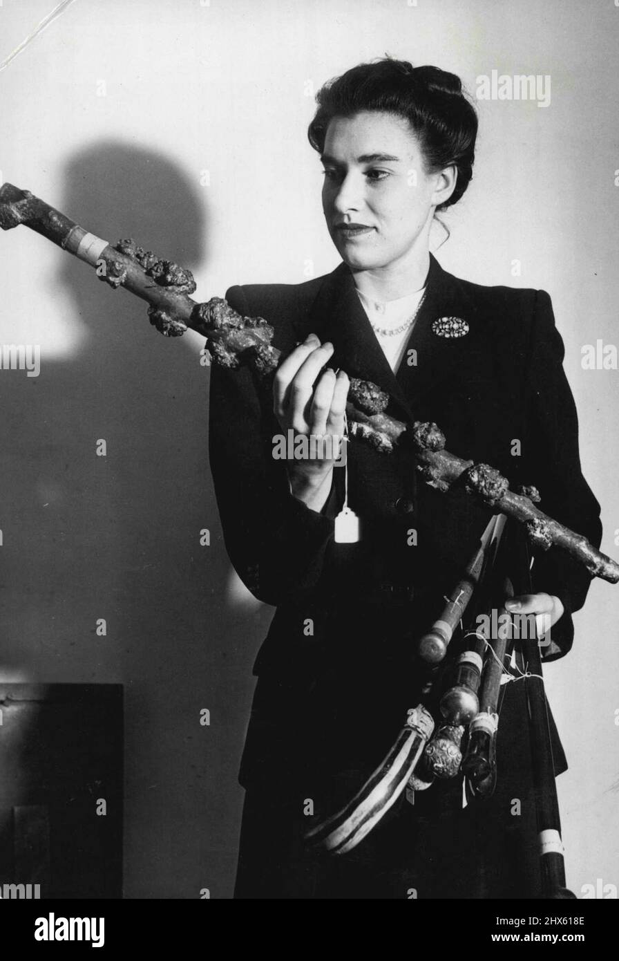 Famous Sticks For Sale: An assistant at Sotheby's examining some of the ...