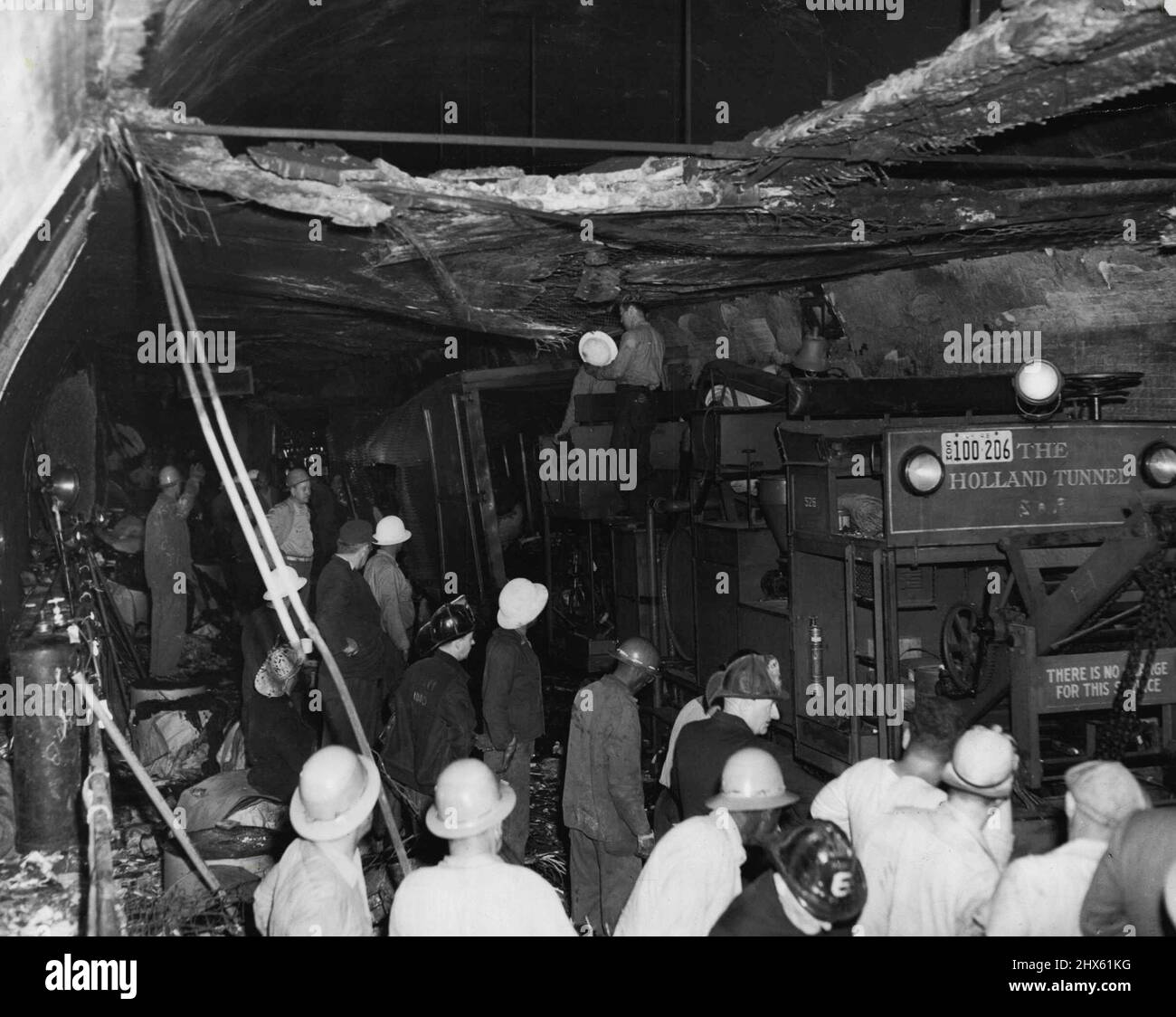 Clear Tunnel After Explosion And Fire. Workers use a towing vehicle ...