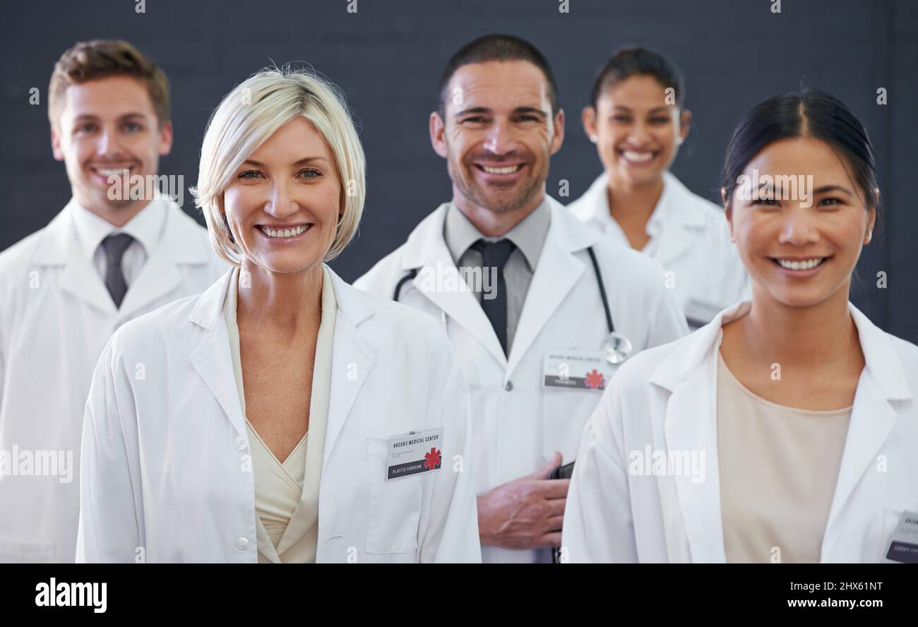 Medicines finest. Studio portrait of a team of doctors standing against ...