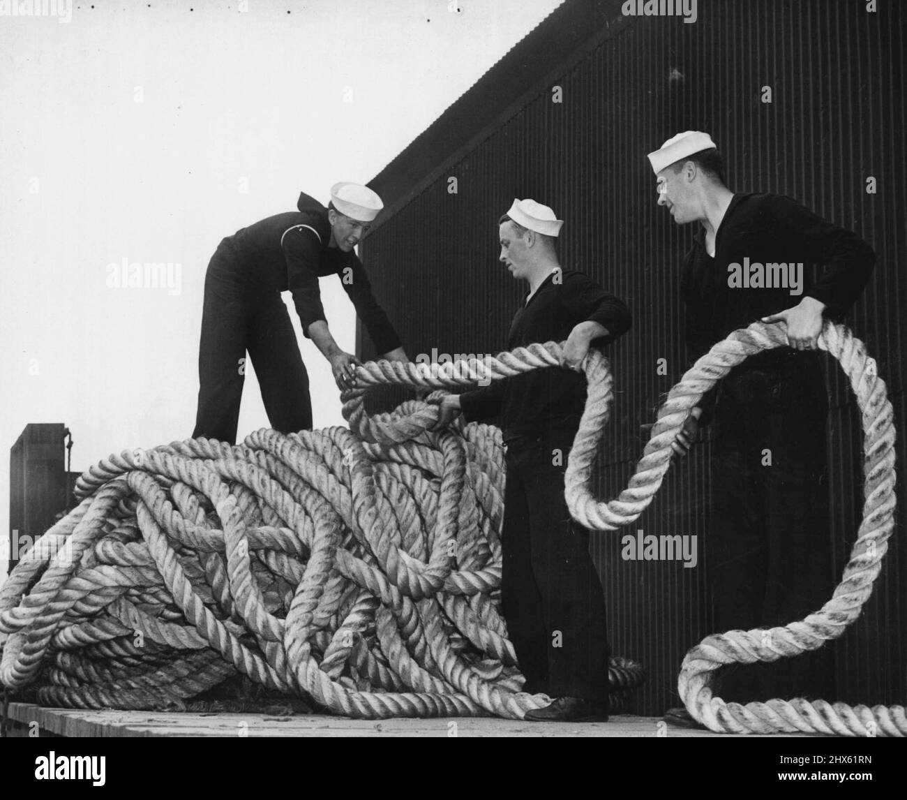 Equipment For Sub Rescue -- Ten inch rope being unwound at the dock to ...