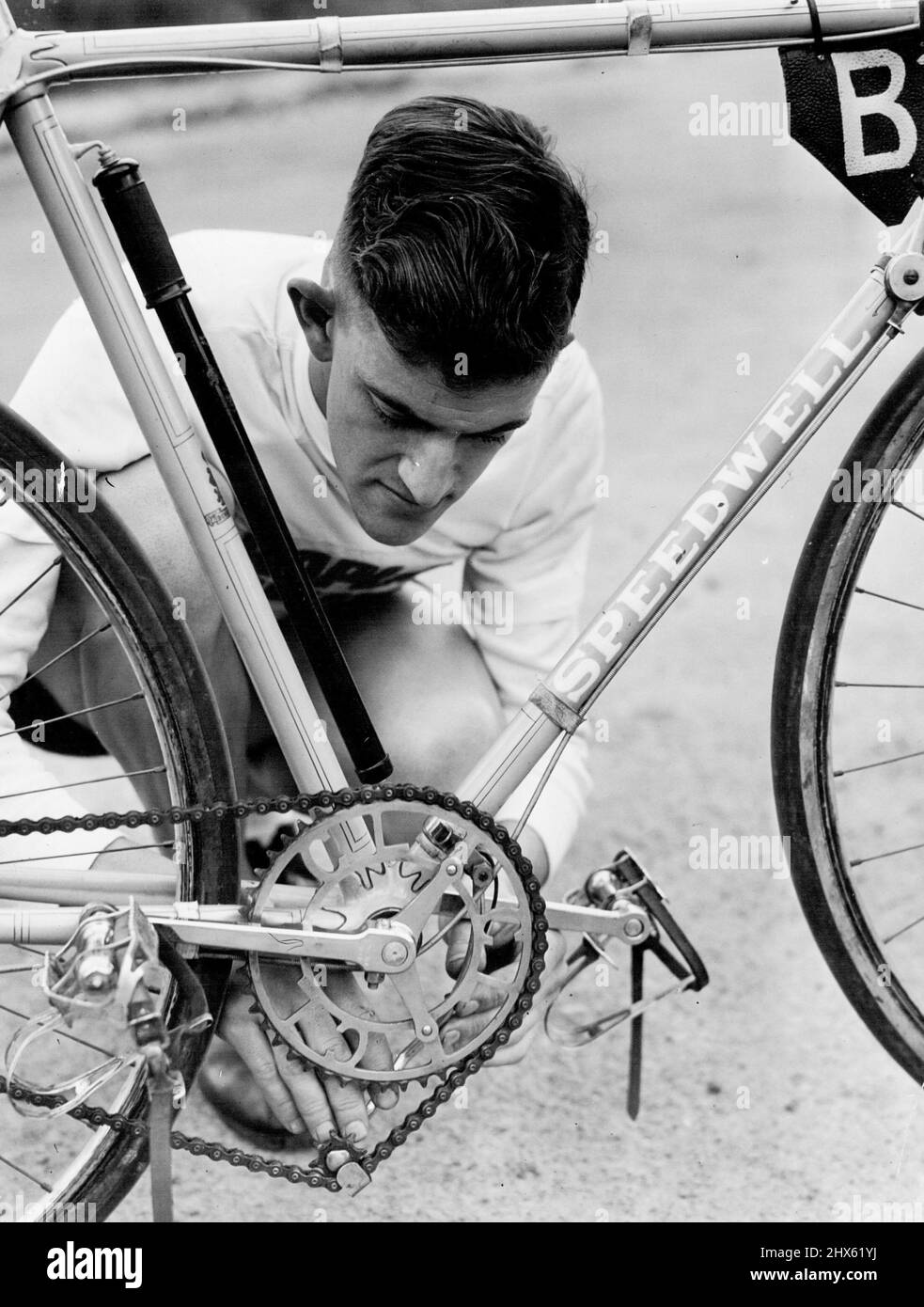 Roy Denny of Dubbo fines bike gears. October 27, 1945.;Roy Denny of ...
