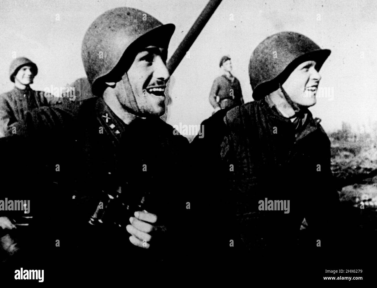Russian soldiers smile with delight as they watch a German plane shot ...