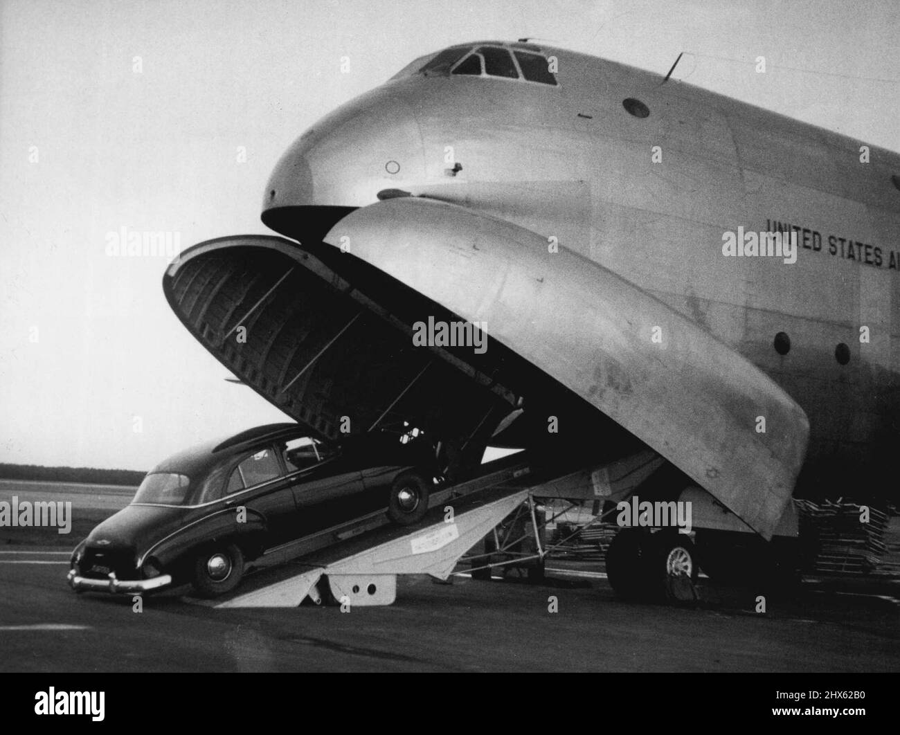 The colonels car about to enter into the nose of the latest Douglas ...