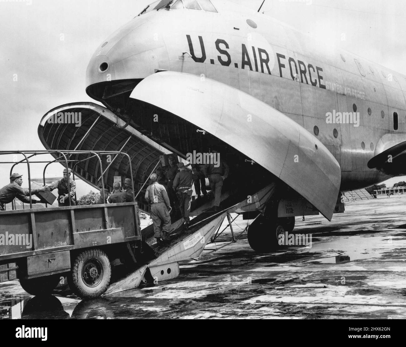 U.S. Air Force C-124 Globemaster is Unloaded in Flood-Stricken East ...