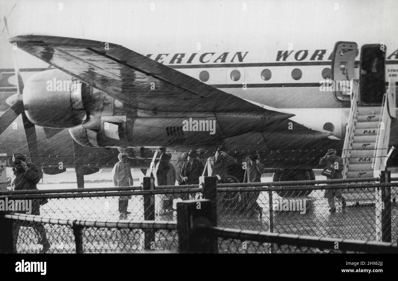 Passengers from A RAA Stratocruiser running thru the rain to the ...
