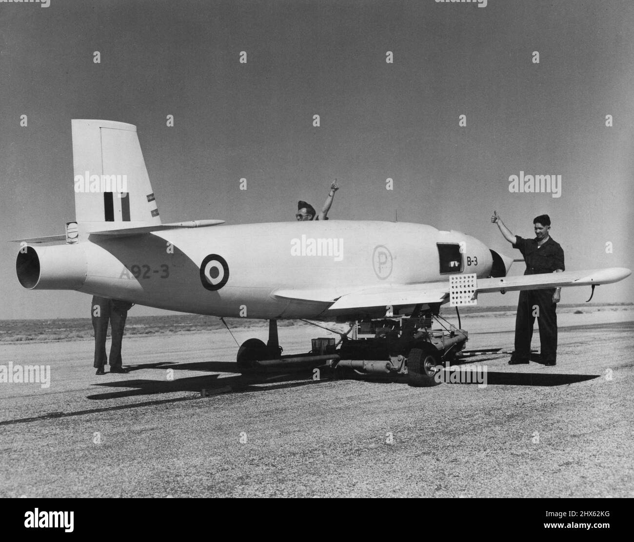 A ground crew gives the "thumbs up (she's ready)" sign to ***** a ...