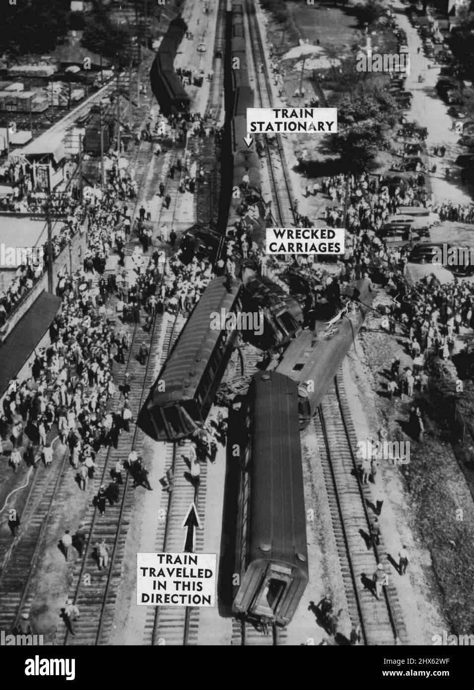 Air View Train Wreck -- Smashed and derailed 'cars Lie' along the right ...