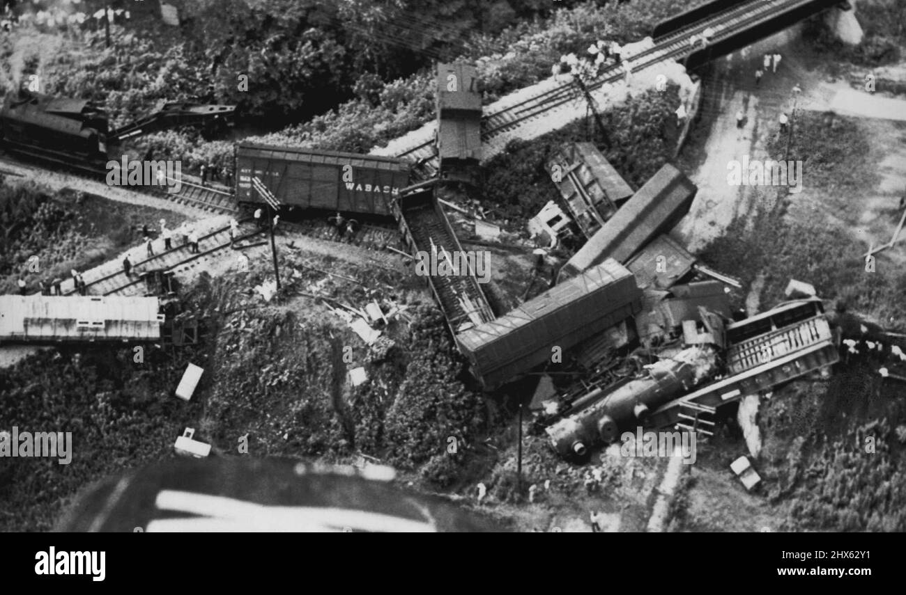 Engine Topples Into Street -- This locomotive and several freight cars ...