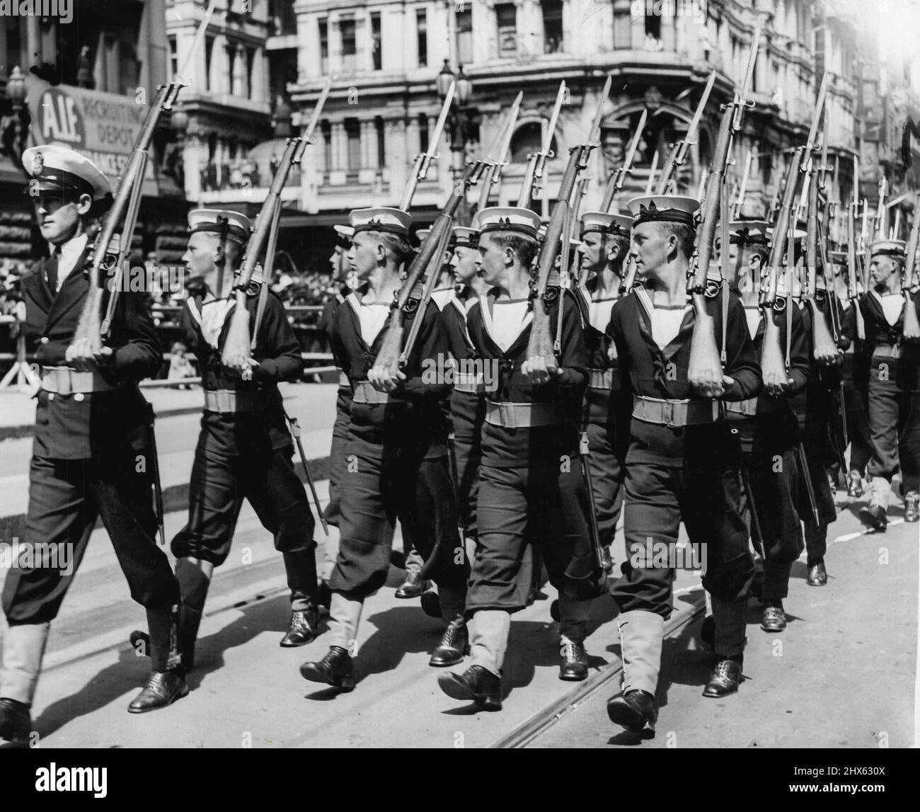 "Eyes Right", as sailors pass the saluting base outside the town hall ...
