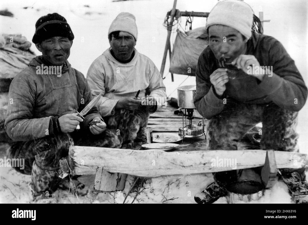 British Arctic Expedition - Eskimos eating Seal meat. August 13, 1934 ...